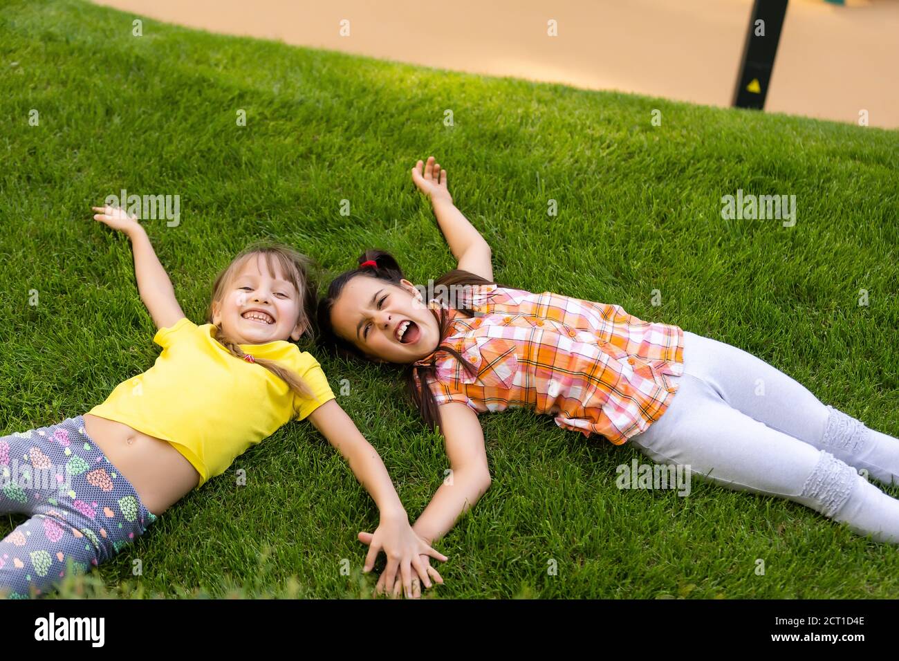 happy excited kids having fun together on playground Stock Photo - Alamy