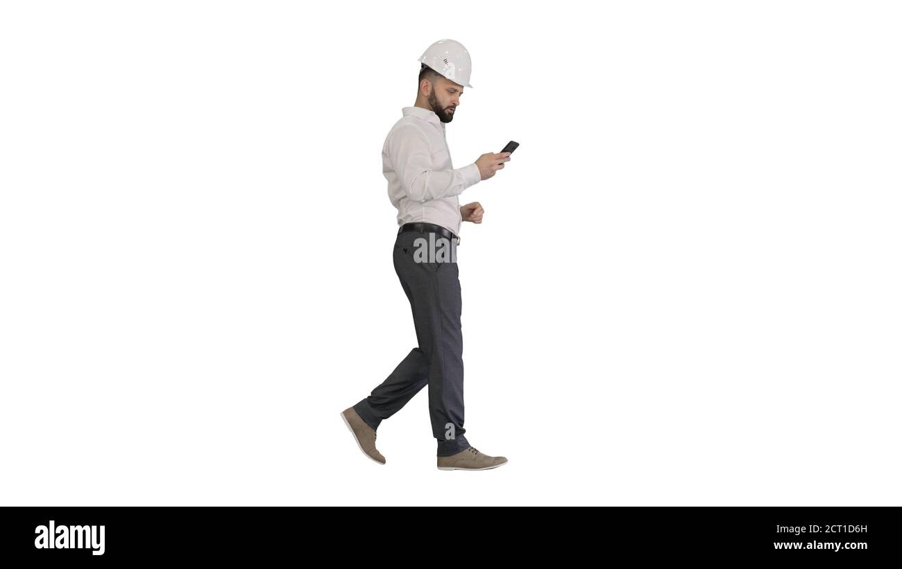 Engineer walking using smartphone on hi-res stock photography and ...