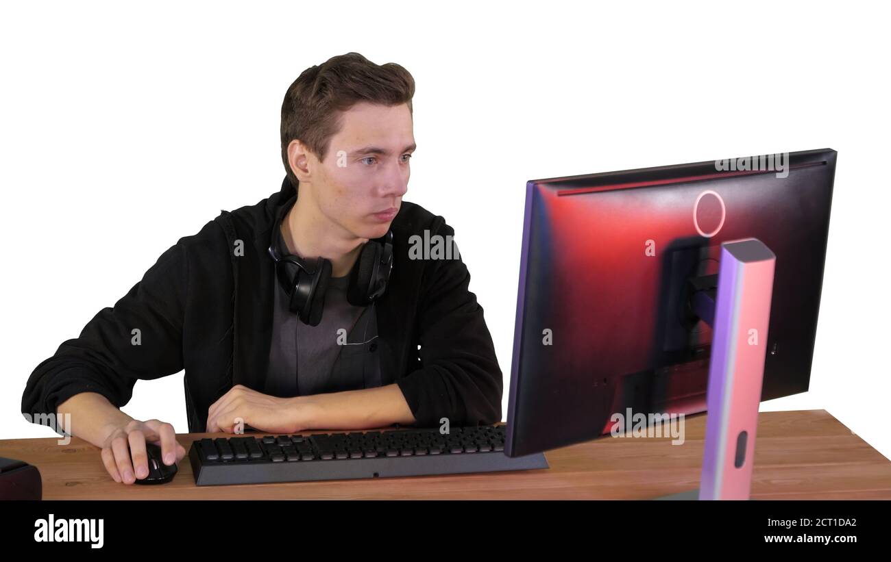 Young man gamer watching stream game on white background Stock Photo ...