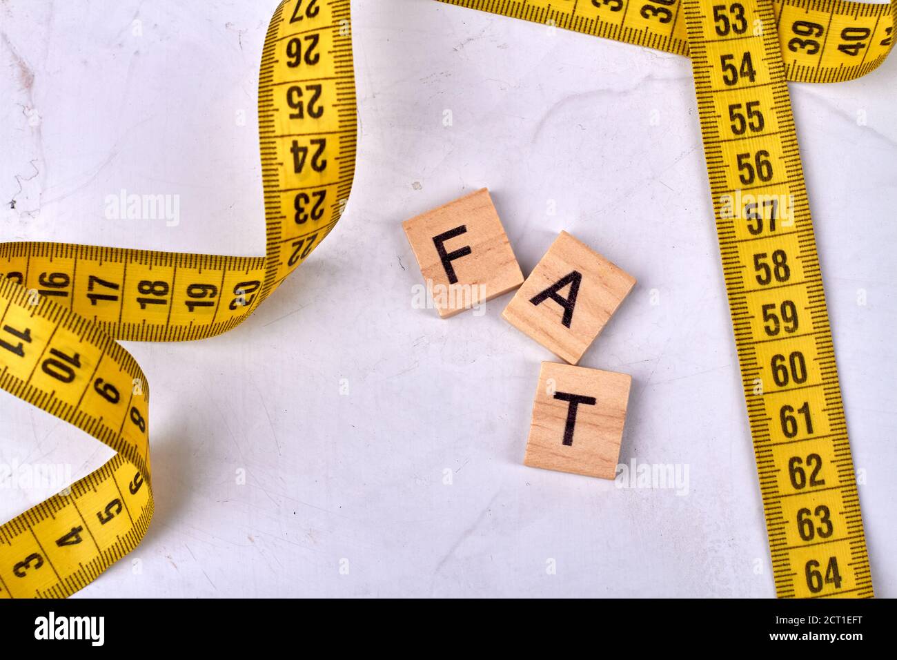 Fat word and measure tape Stock Photo - Alamy