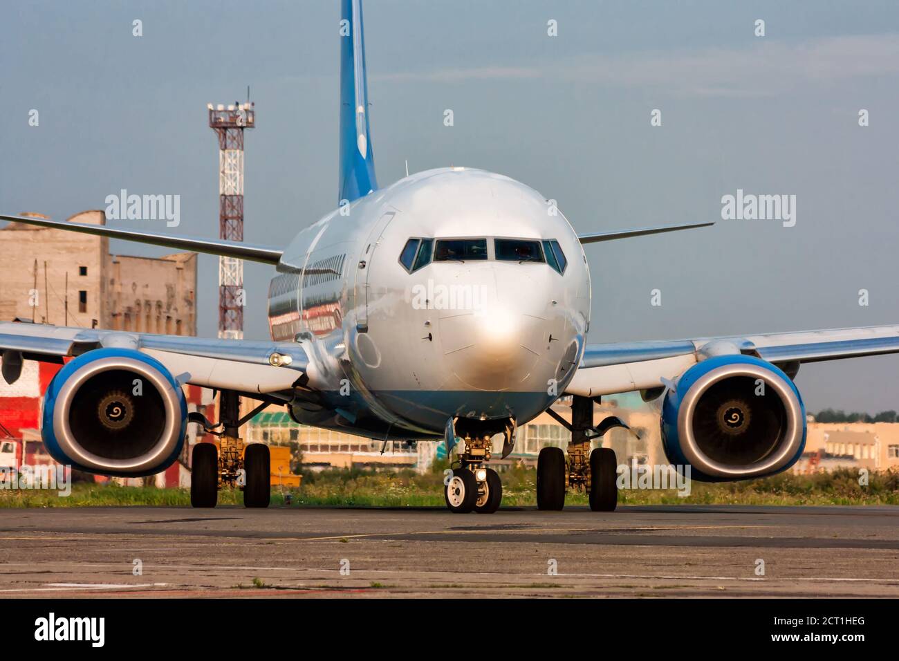 Airplane turns on Runway Stock Photo - Alamy