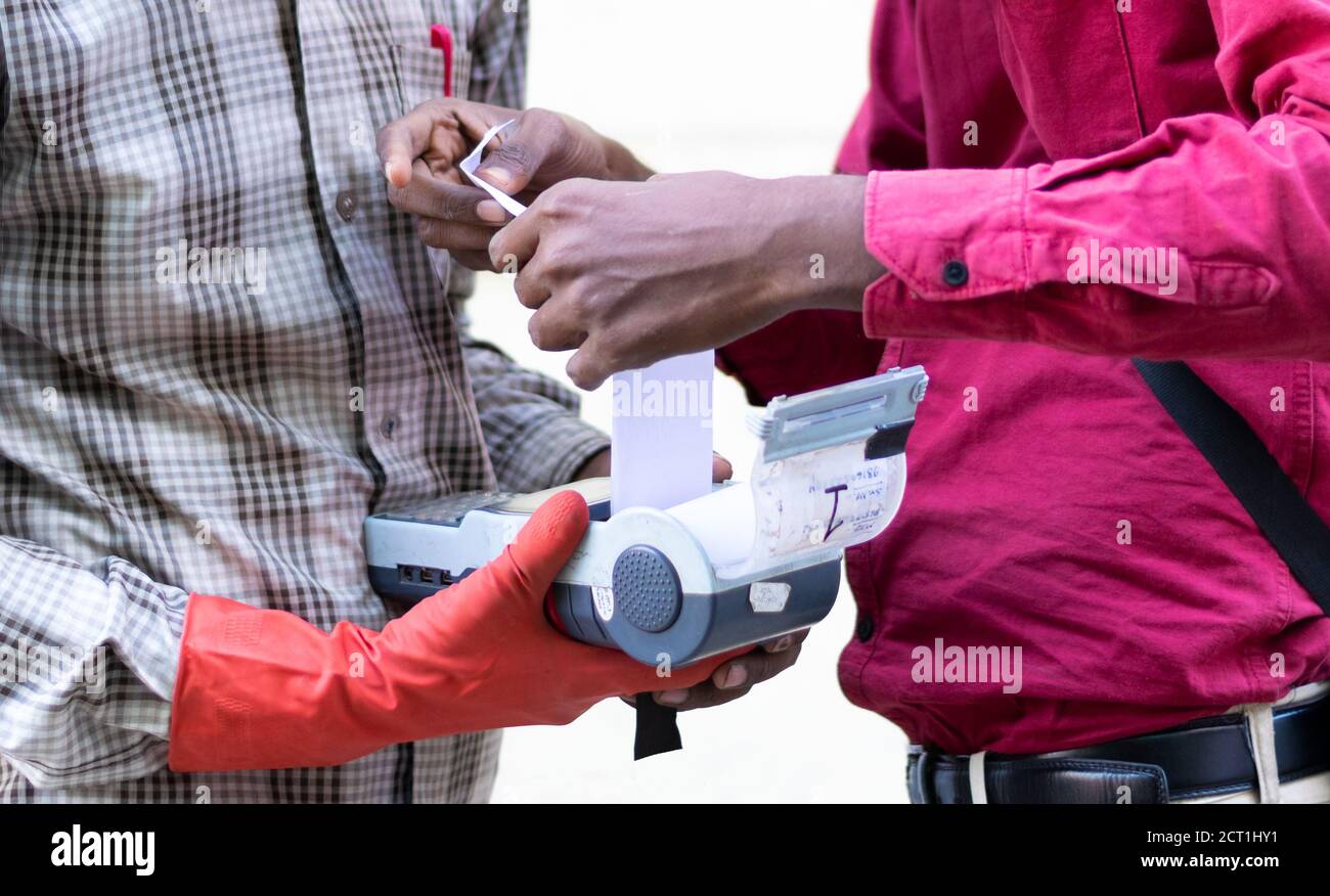 Workers are giving electricity bill by electricity bill machine in ...