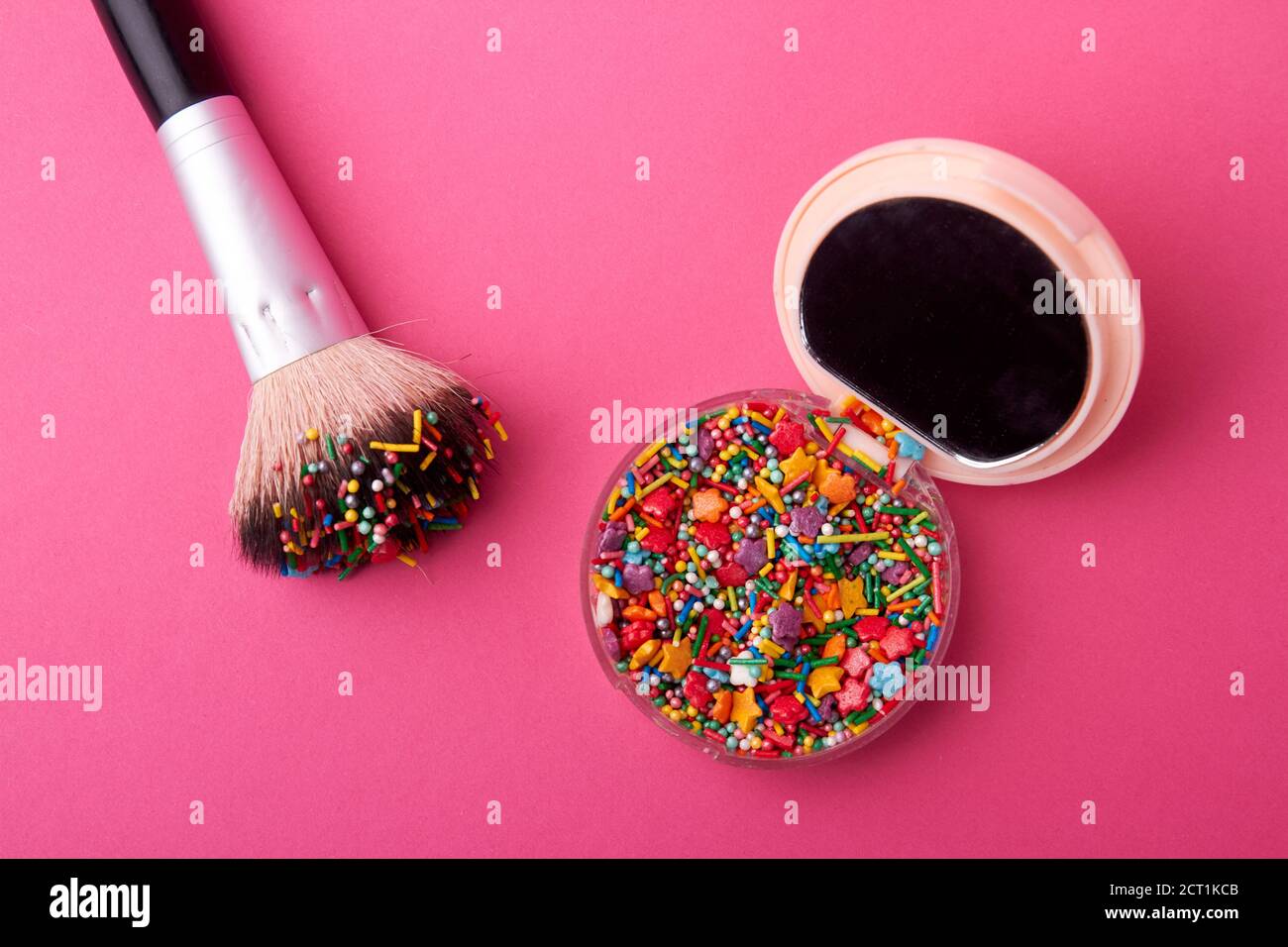 Cosmetic powder case with sweet sprinkles Stock Photo - Alamy