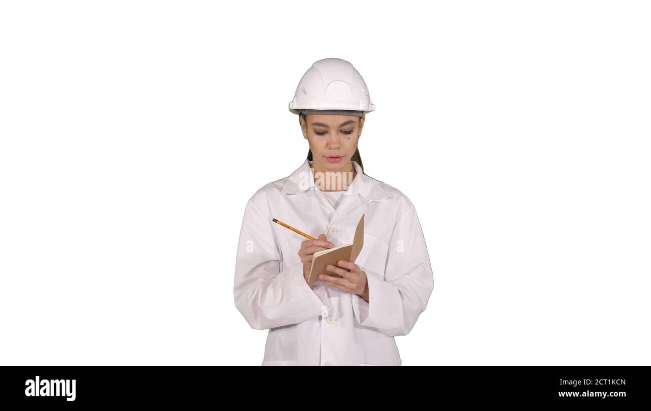 Woman engineer writing checklist walking on white background Stock ...
