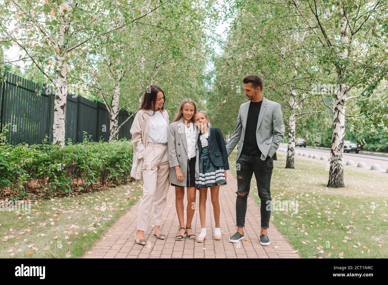Family with two kids back to school Stock Photo - Alamy