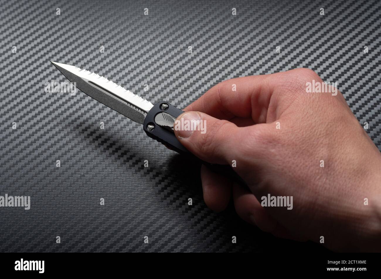 A knife with a double-sided sharpened blade. Automatic folding knife ...