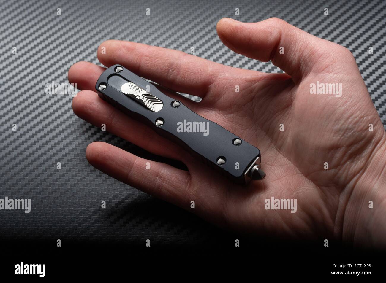 Pocket knife in folded position. Automatic folding knife Stock Photo ...