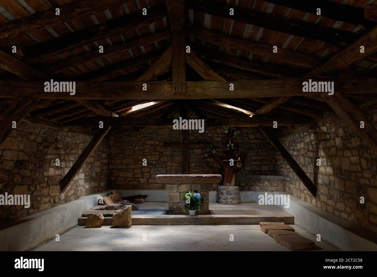 Altar of an old rustic church with stonewalls Stock Photo - Alamy