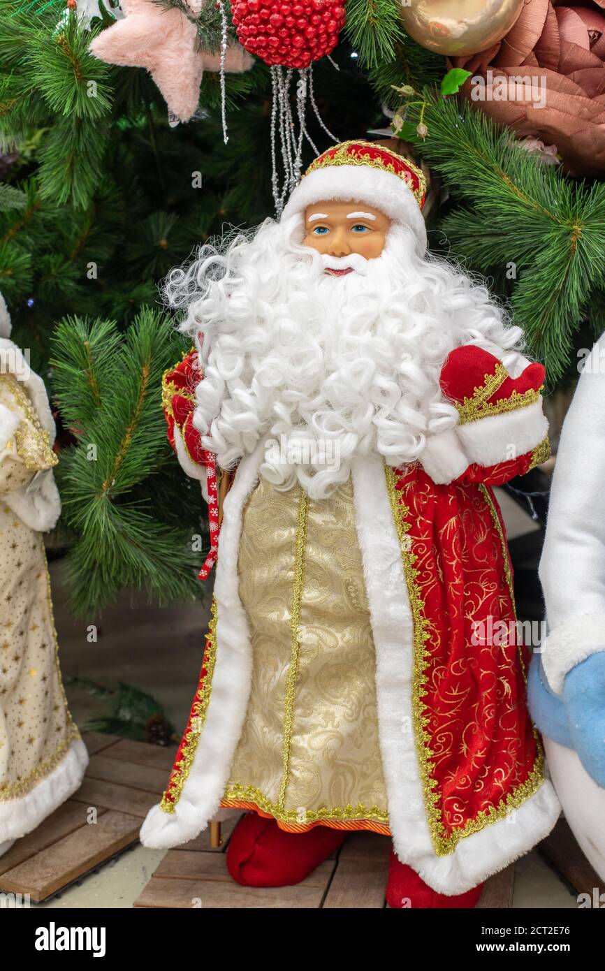 Santa Claus full-length, life-size doll in a Santa costume, a lush ...