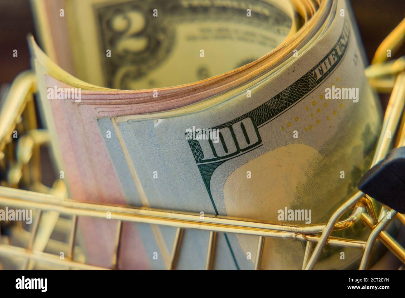 Supermarket grocery push cart for shopping with bundle of dollars money ...