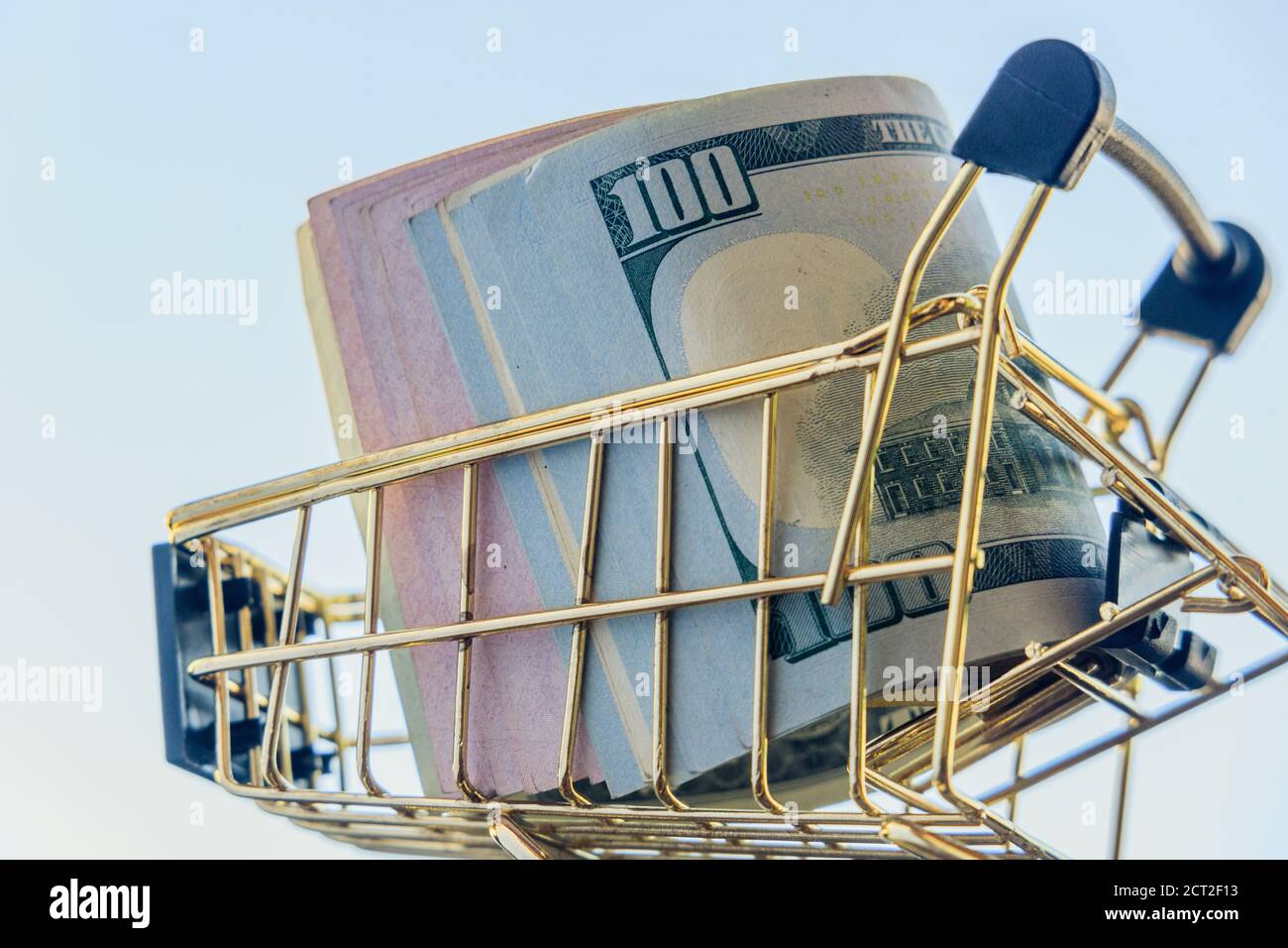 Supermarket grocery push cart for shopping with bundle of dollars money ...