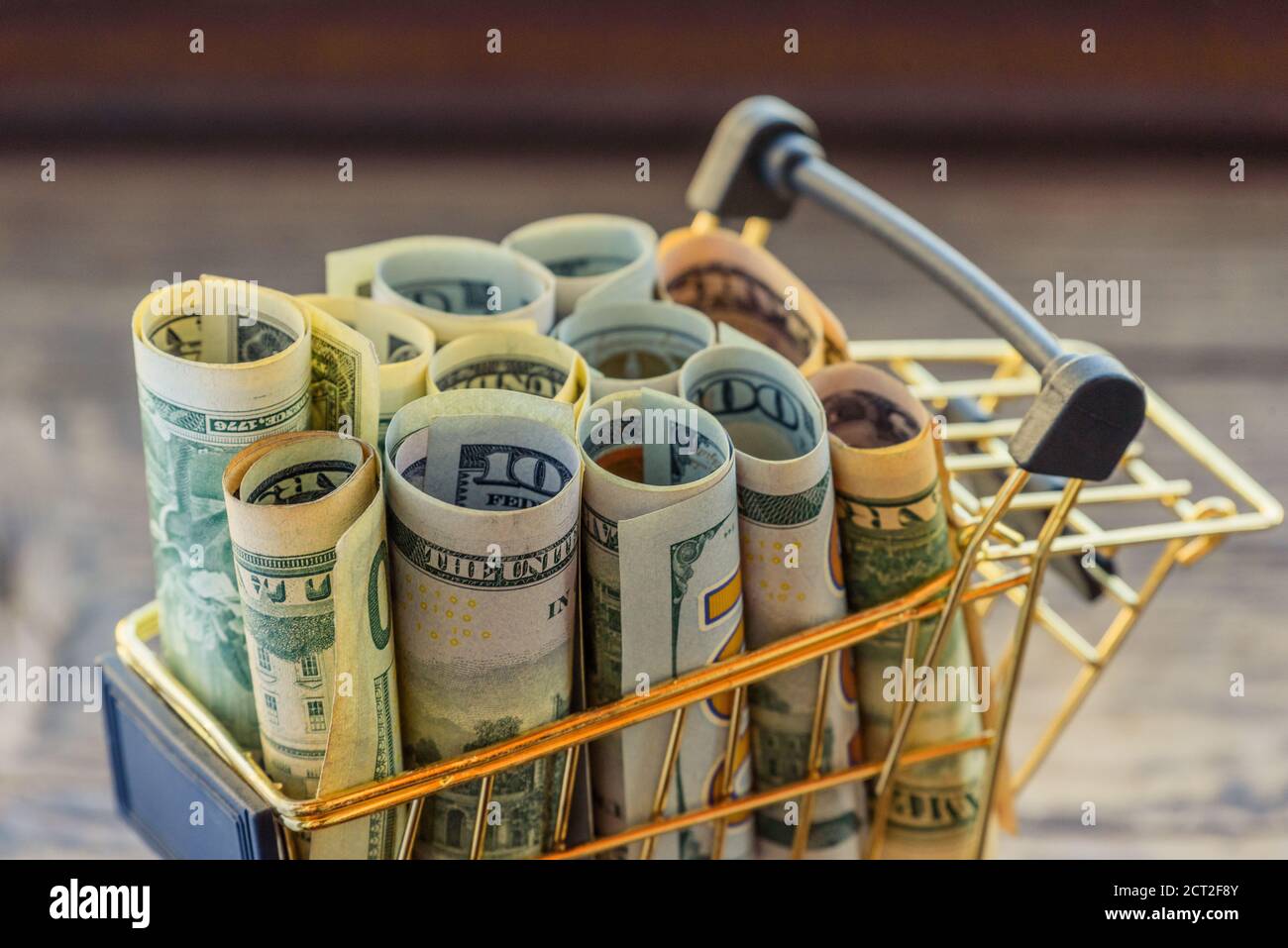 Supermarket grocery push cart for shopping with bundle of dollars money ...