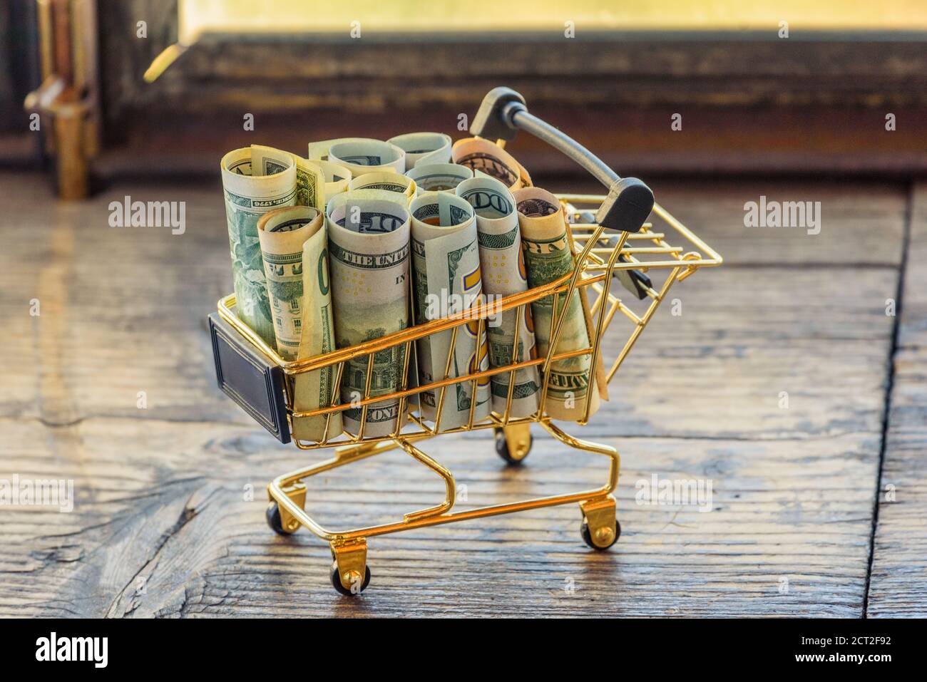 Supermarket grocery push cart for shopping with bundle of dollars money ...