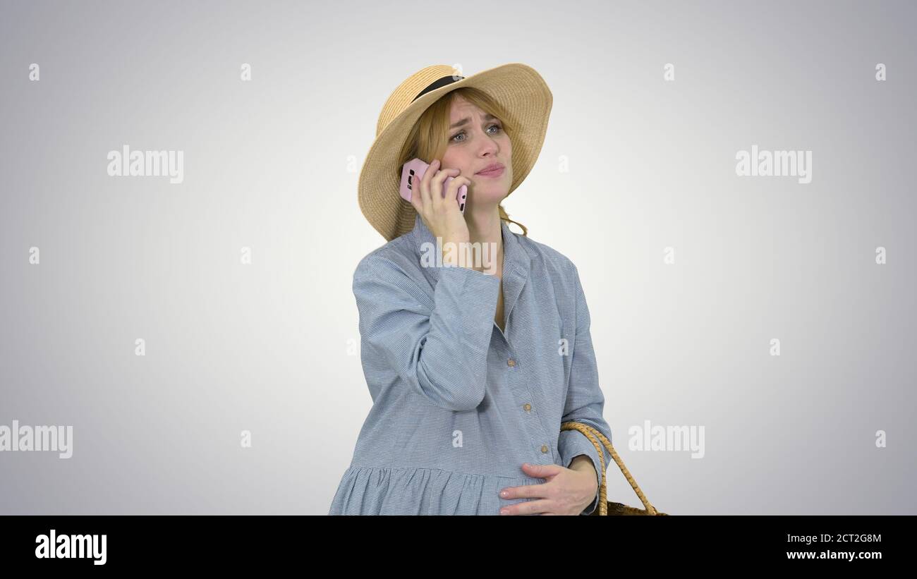 Worried Pregnant Woman Talking on the Phone having contractions Stock ...