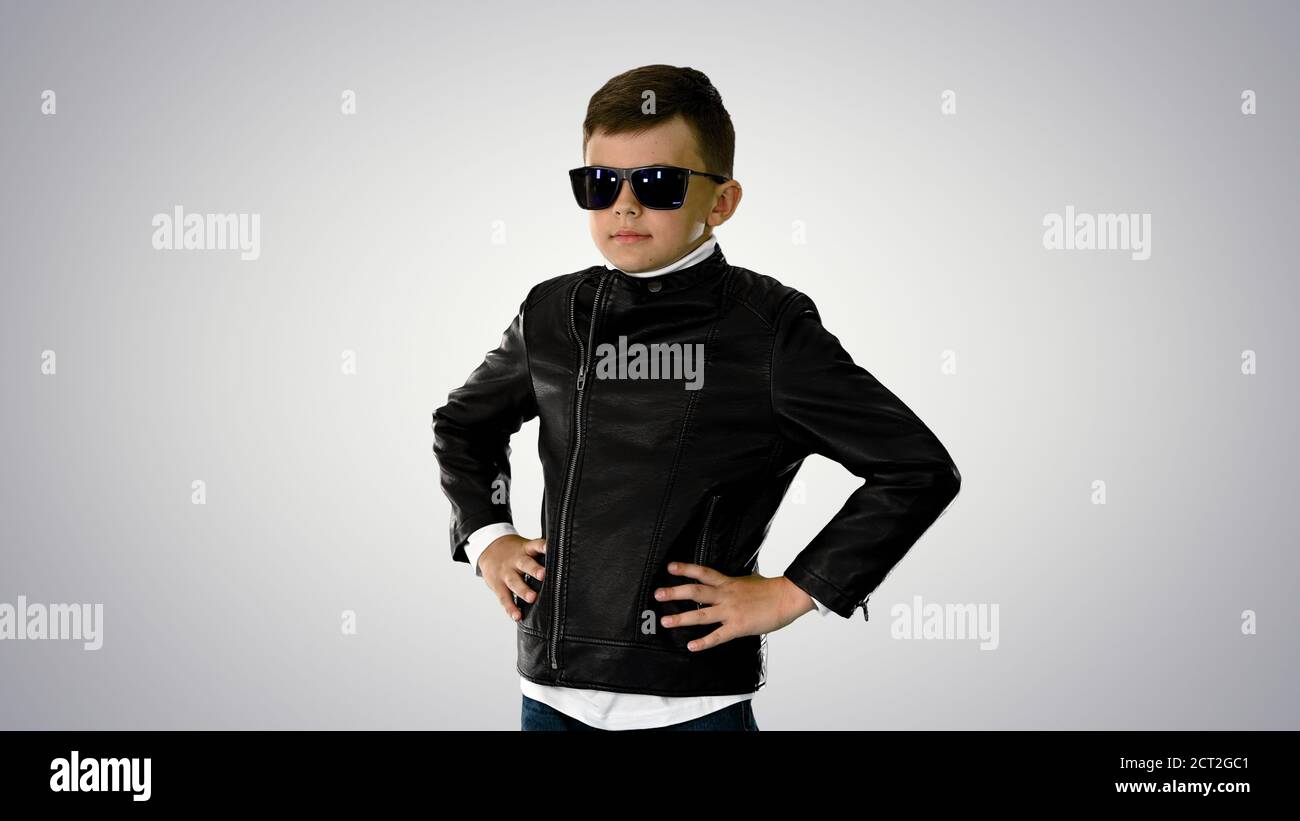 Boy putting on jacket hi-res stock photography and images - Alamy