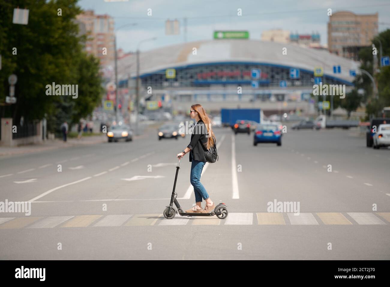 Woman commuter on electric scooter hi-res stock photography and images ...