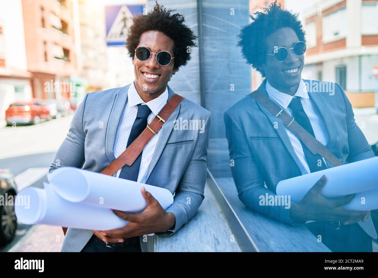Young handsome african american architect man smiling happy. Leaning on ...