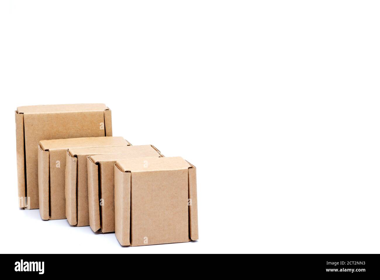 Cardboard boxes of various sizes are arranged in a row diagonally ...