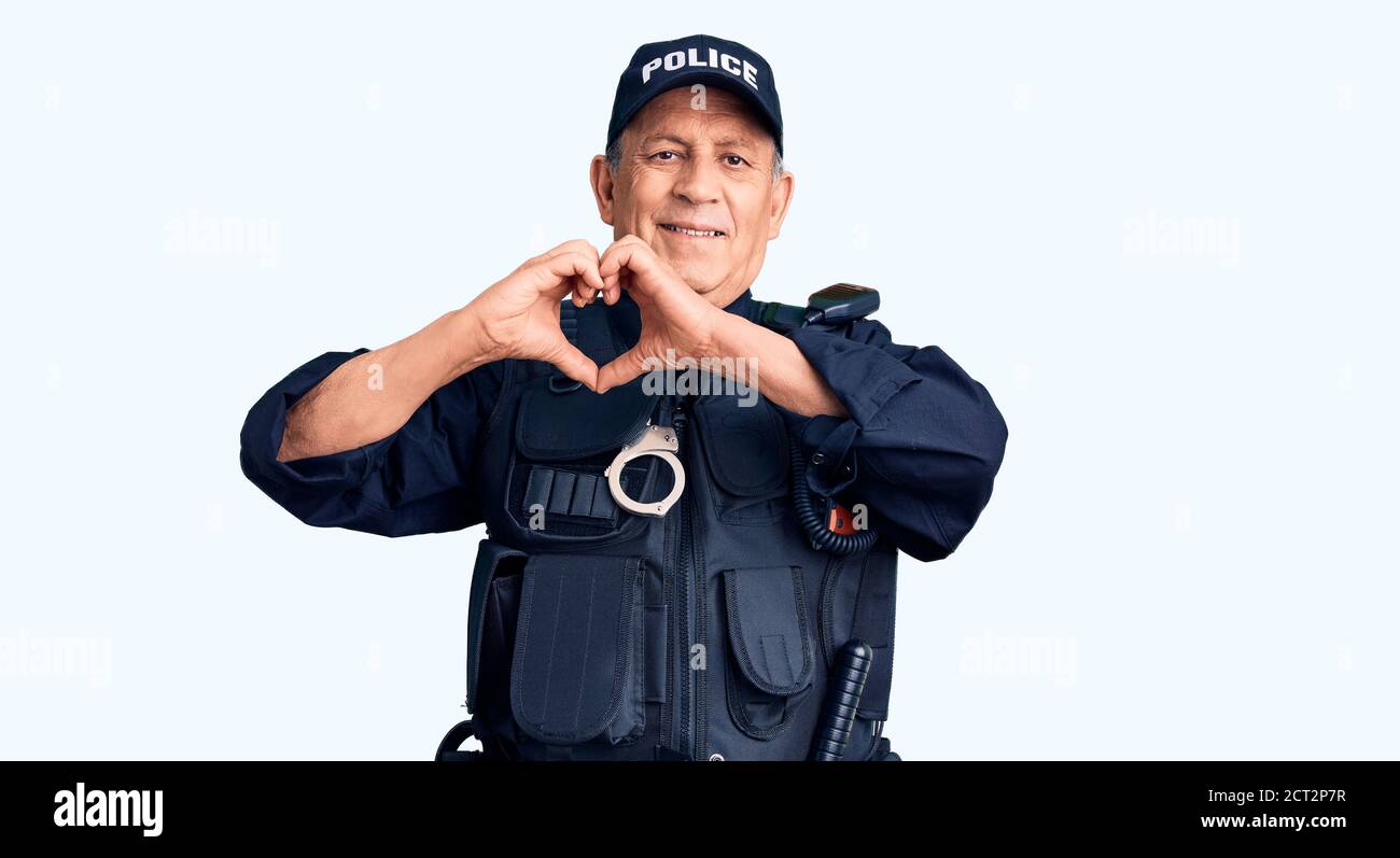 Senior handsome man wearing police uniform smiling in love showing ...