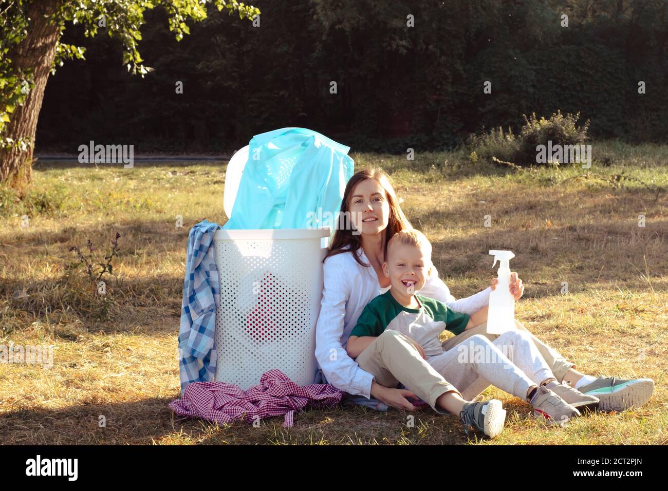 son kissing mom on break from household chores Stock Photo - Alamy