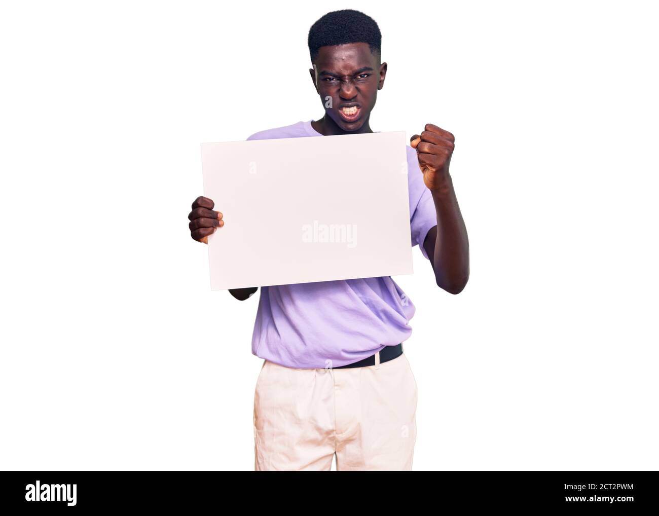 Young african american man holding blank empty banner annoyed and ...