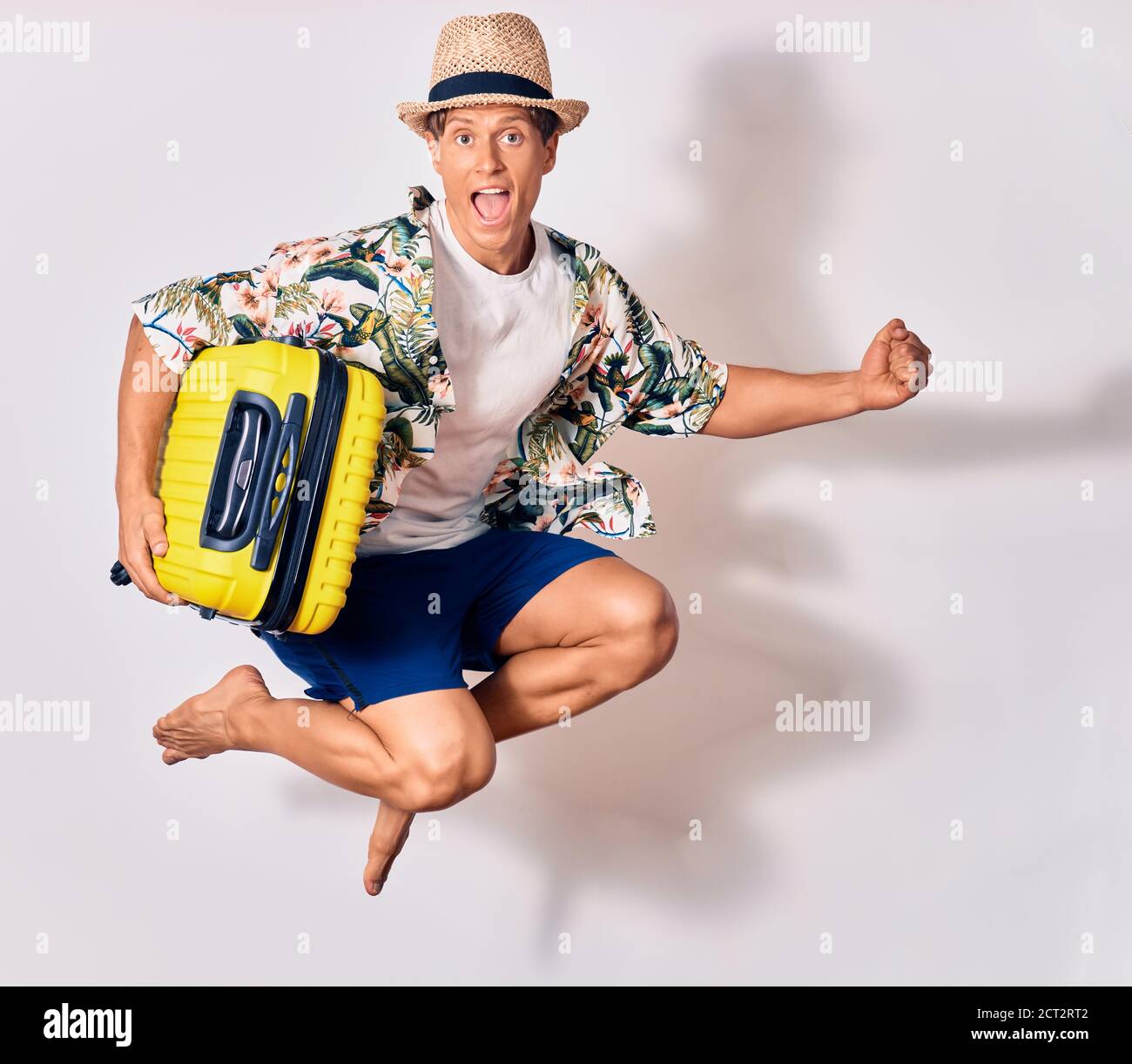 Young handsome man on vacation wearing summer clothes and hat smiling ...