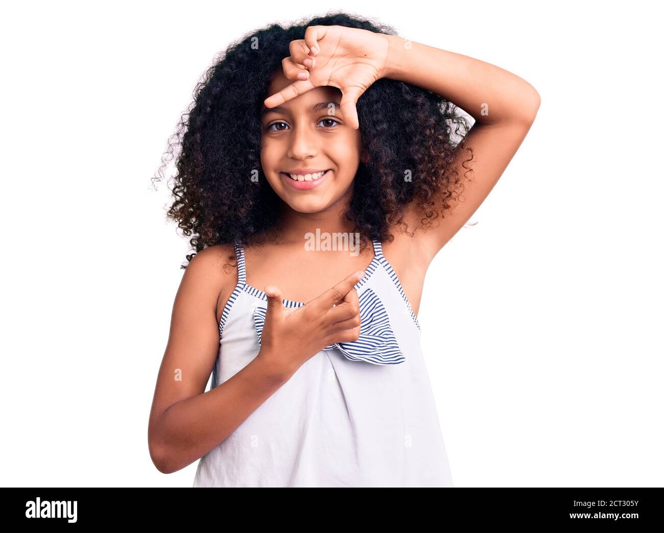 African american child with curly hair wearing casual clothes smiling ...