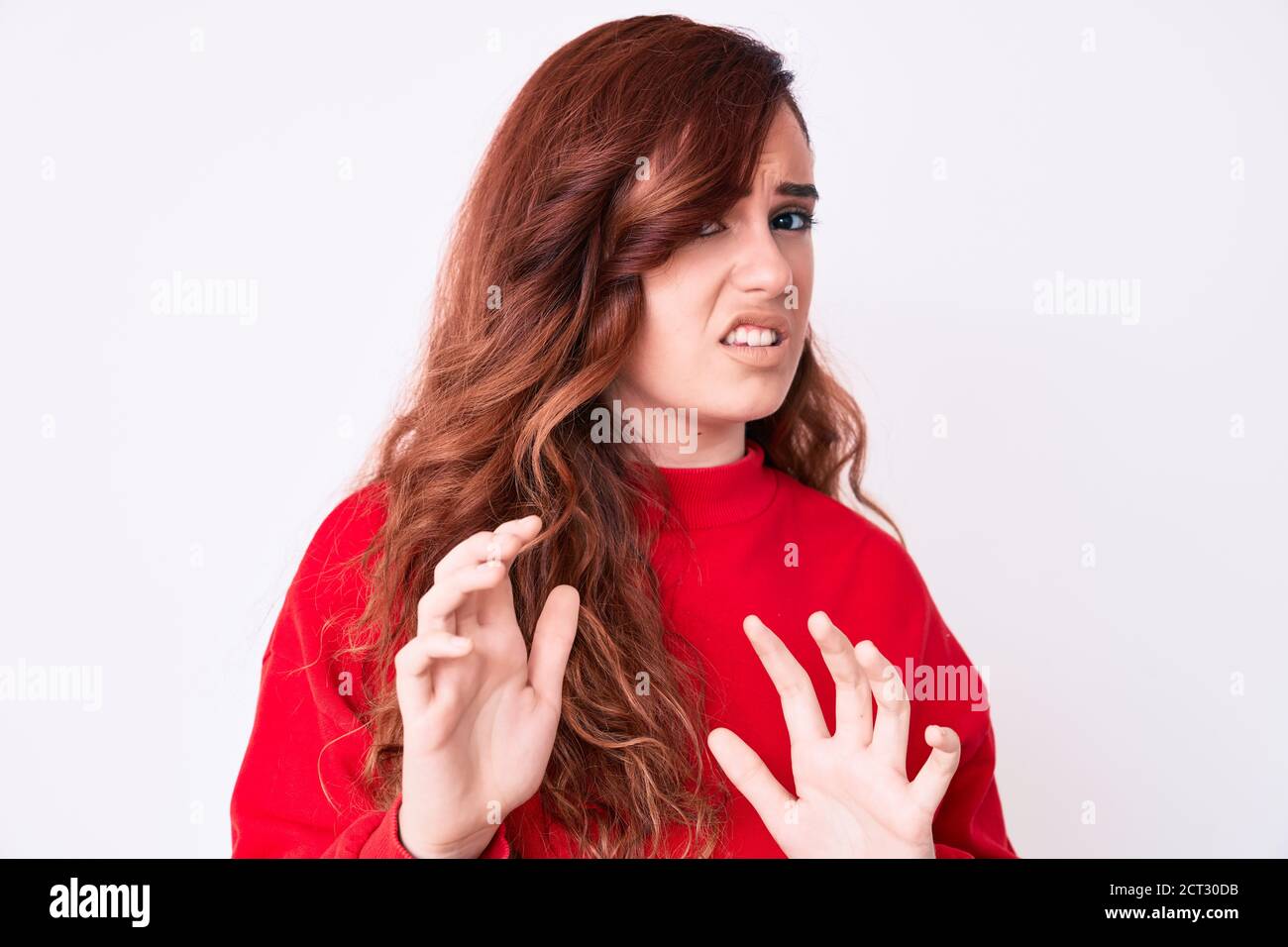 Young beautiful woman wearing casual clothes disgusted expression ...