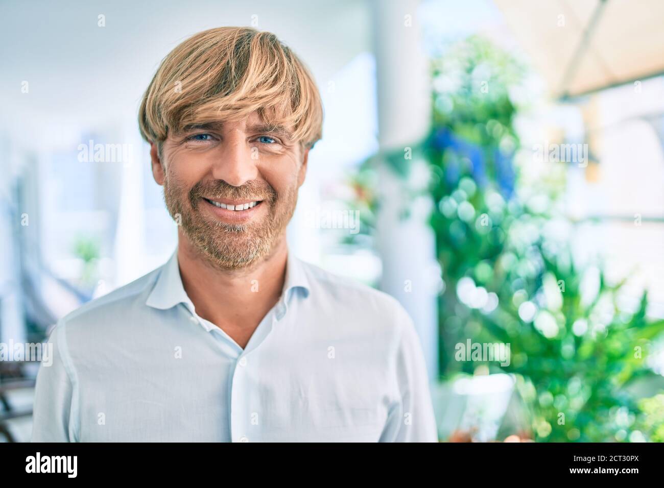 Young irish man smiling happy standing at terrace Stock Photo - Alamy