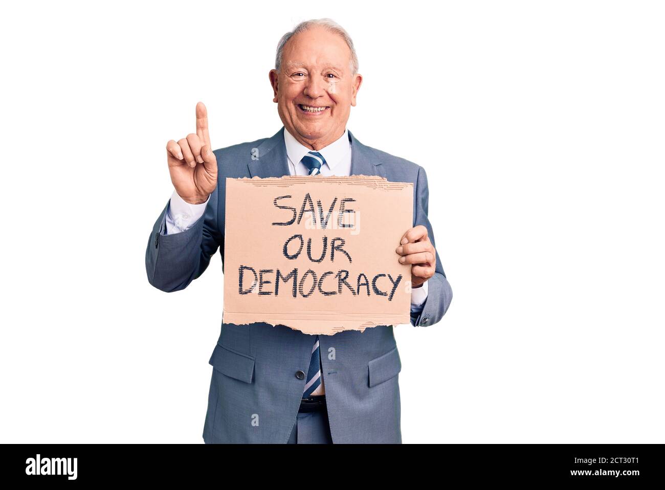Senior handsome grey-haired man holding save our democracy cardboard ...