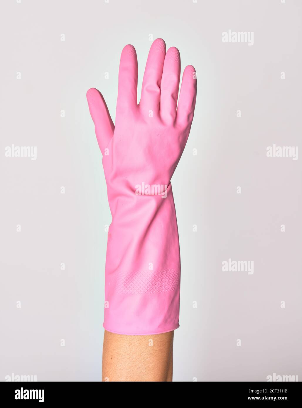 Hand of caucasian young woman wearing pink cleaning glove doing ...
