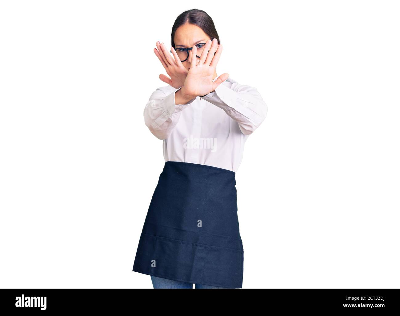 Beautiful brunette young woman wearing professional waitress apron ...