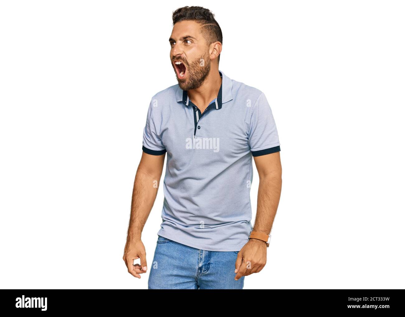 Handsome man with beard wearing casual clothes angry and mad screaming ...