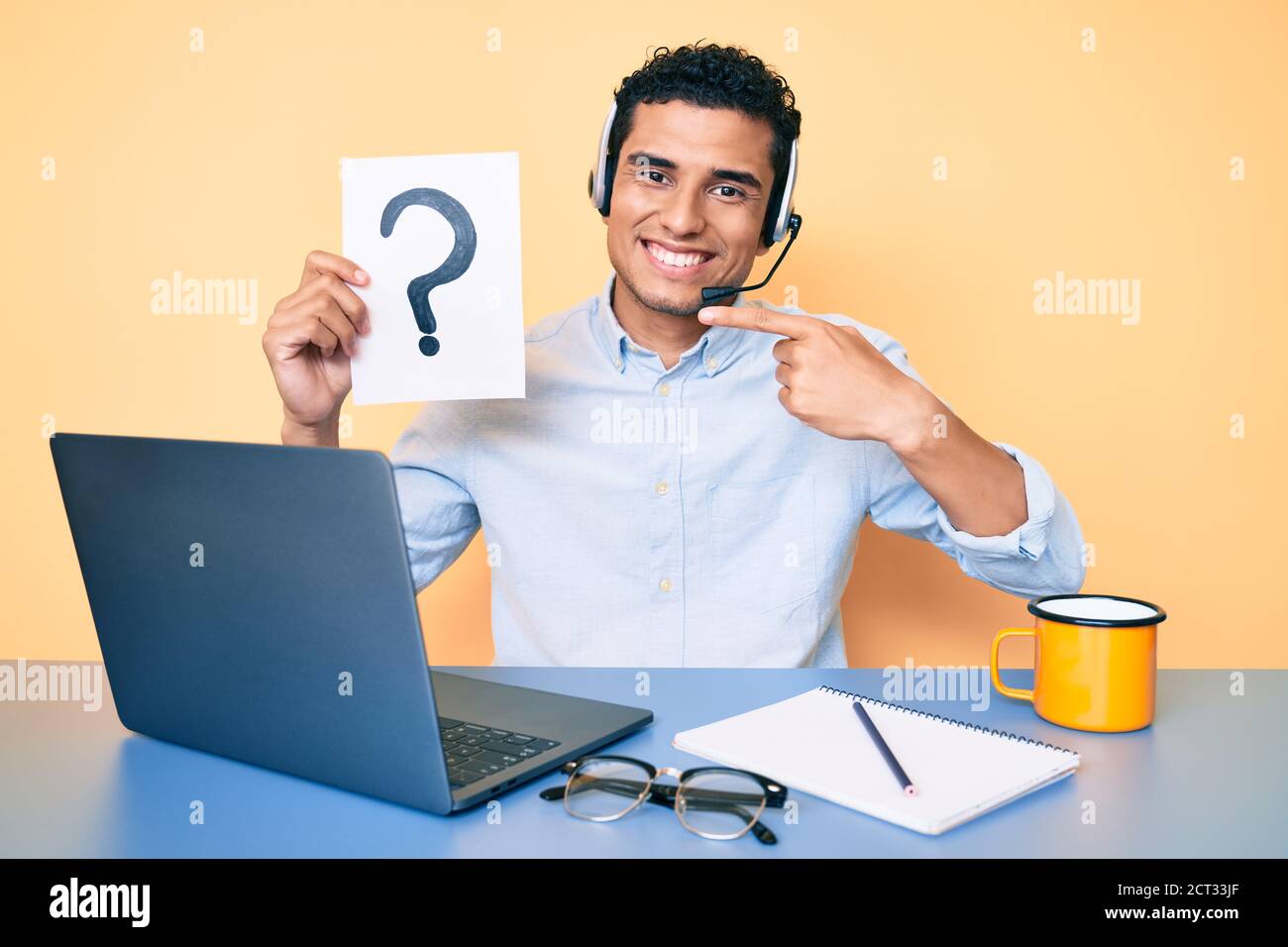 Young handsome hispanic man holding question mark as customer support ...