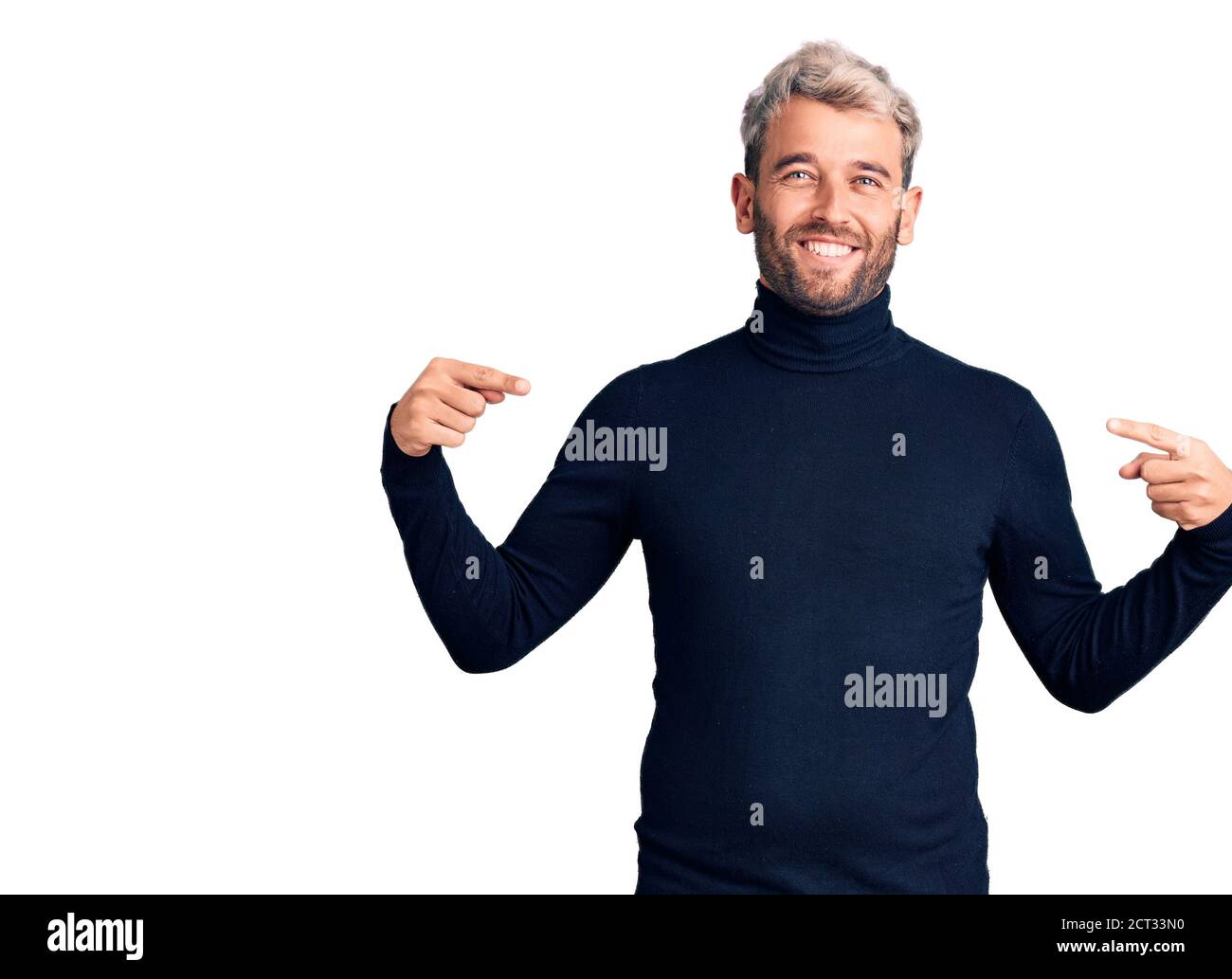 Young handsome blond man wearing casual turtleneck sweater looking ...