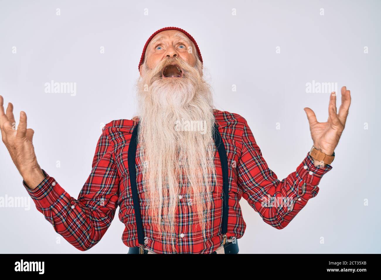 Old senior man with grey hair and long beard wearing hipster look with ...