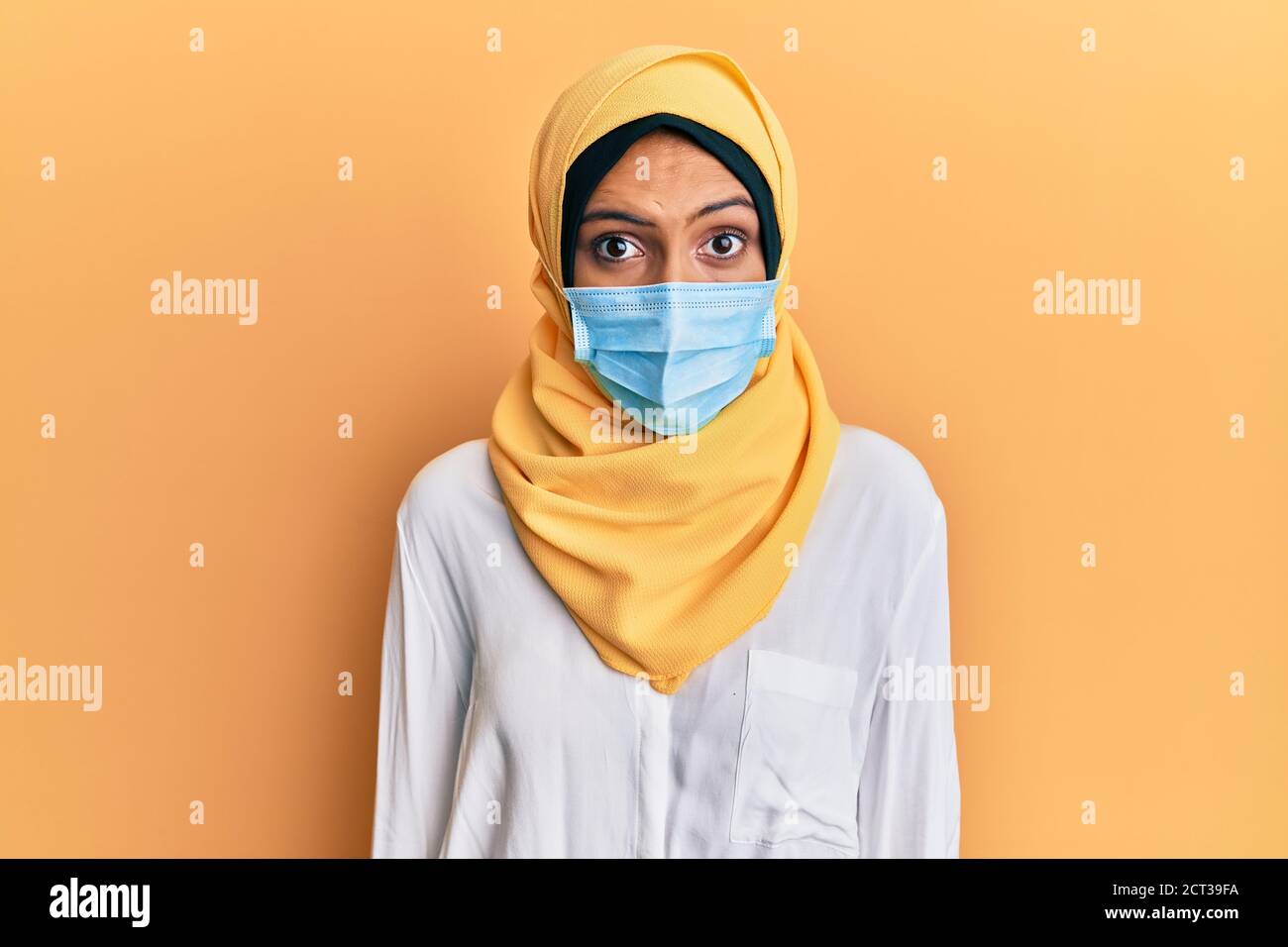 Young brunette arab woman wearing traditional islamic hijab and medical ...
