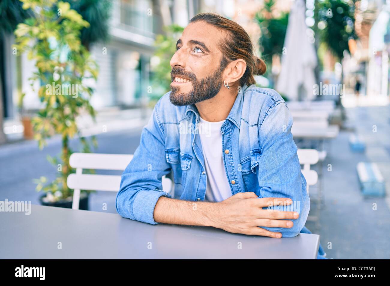 Young middle eastern man smiling happy sitting at the coffee shop ...