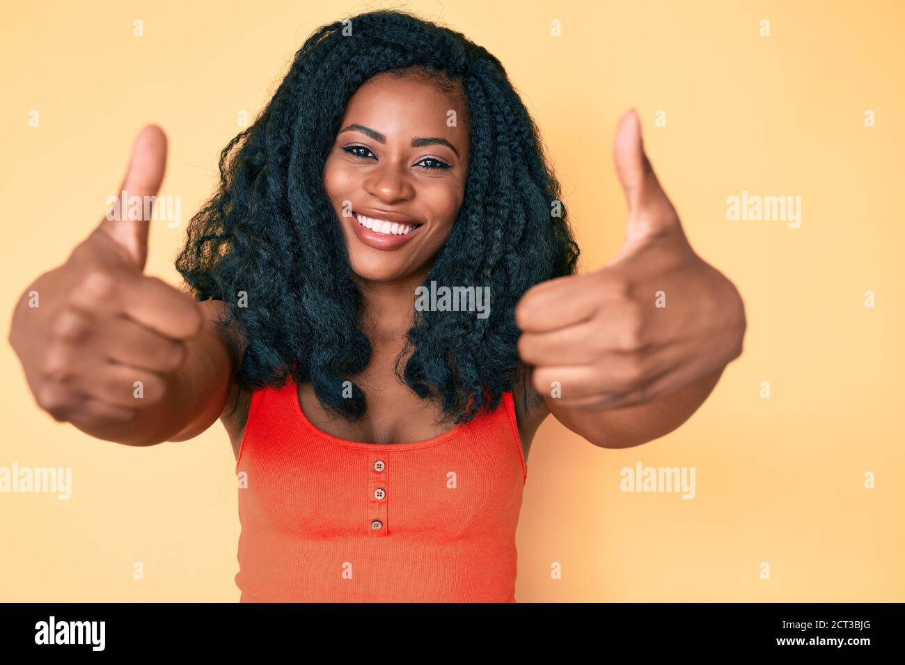 Beautiful african woman wearing casual clothes approving doing positive ...