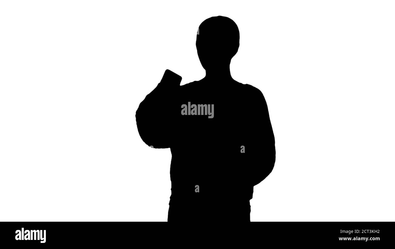 Silhouette Smiling and gesturing young woman having video call o Stock ...