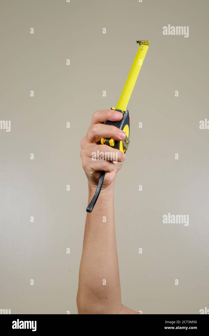 industry worker hand holding mechanical tool Stock Photo - Alamy