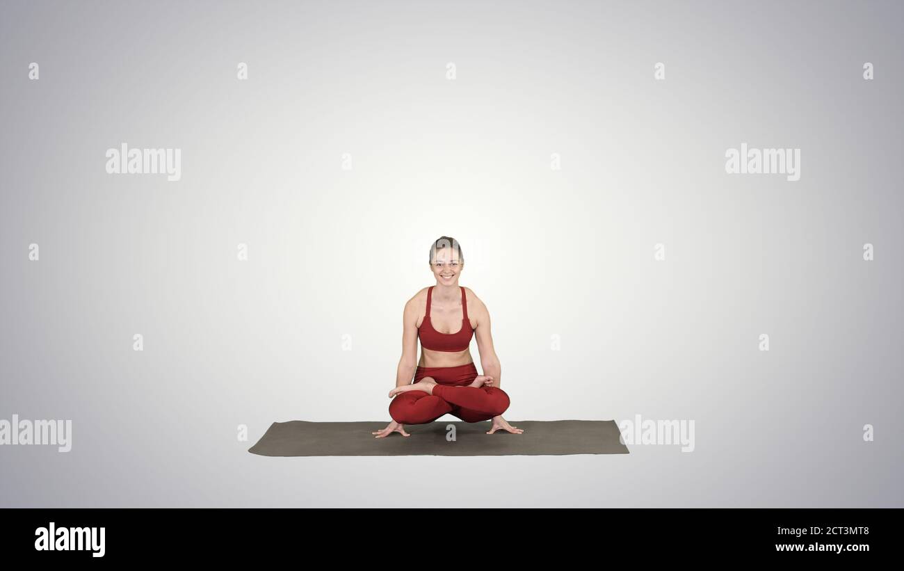 Young sporty woman practicing yoga, doing Scale exercise, Tolasa Stock ...