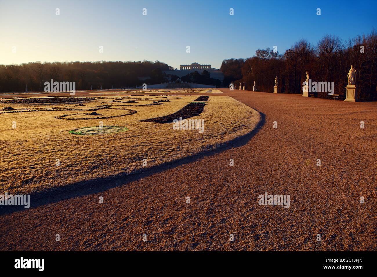 Public garden in Vienna . Park with walking path and statues Stock ...