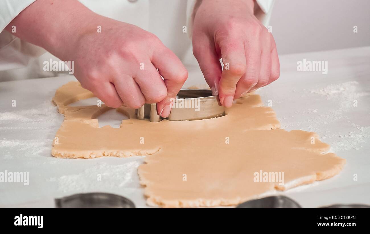 Step by step. Cutting sugar cookie dough with Easter shaped cookie ...