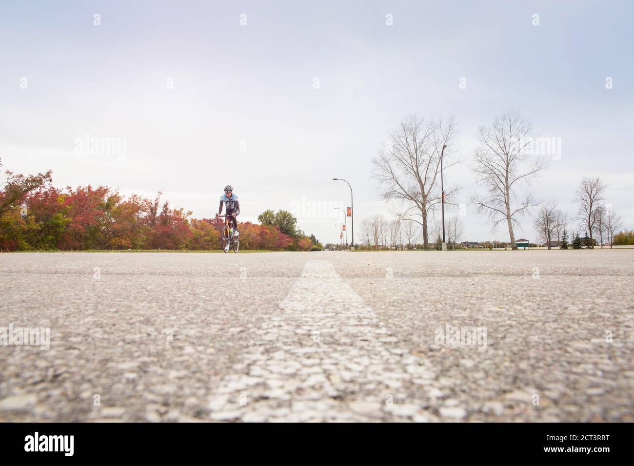 Cycling in a long Road. Journey Concept Stock Photo - Alamy