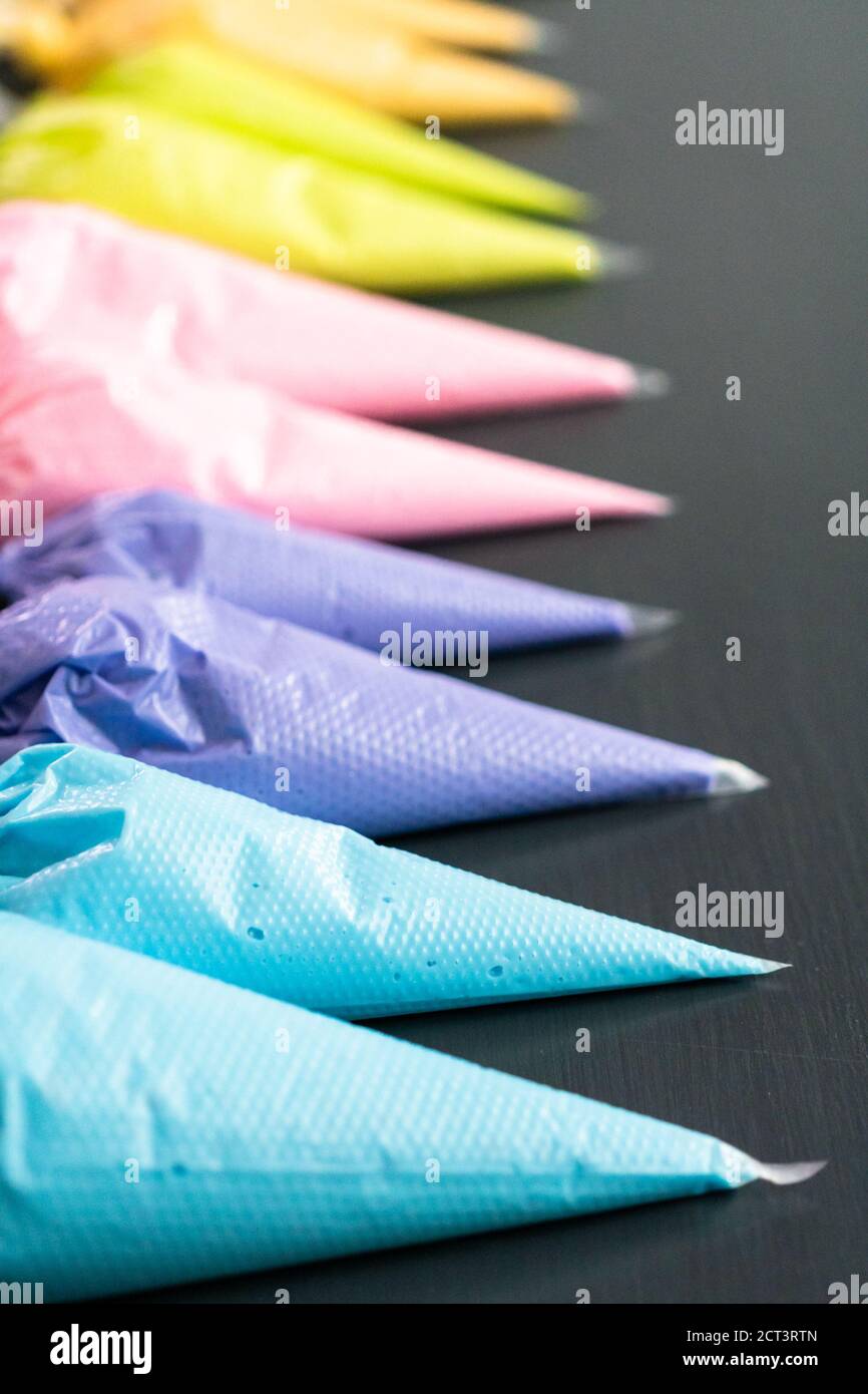 Variety of colors of royal icing in plastic piping bags Stock Photo - Alamy