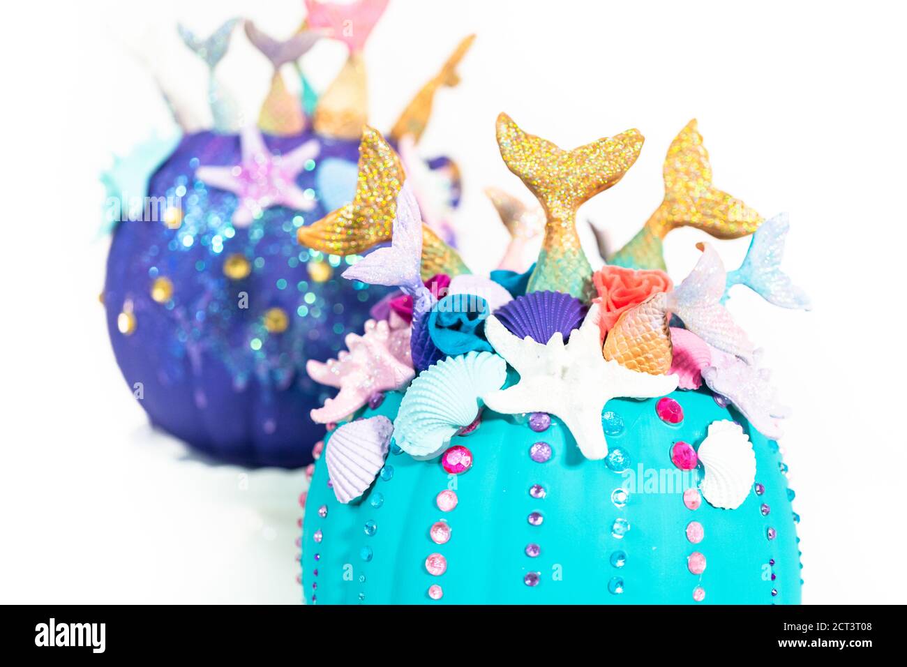 Halloween craft pumpkins decorated with mermaid tails, glitter, and ...