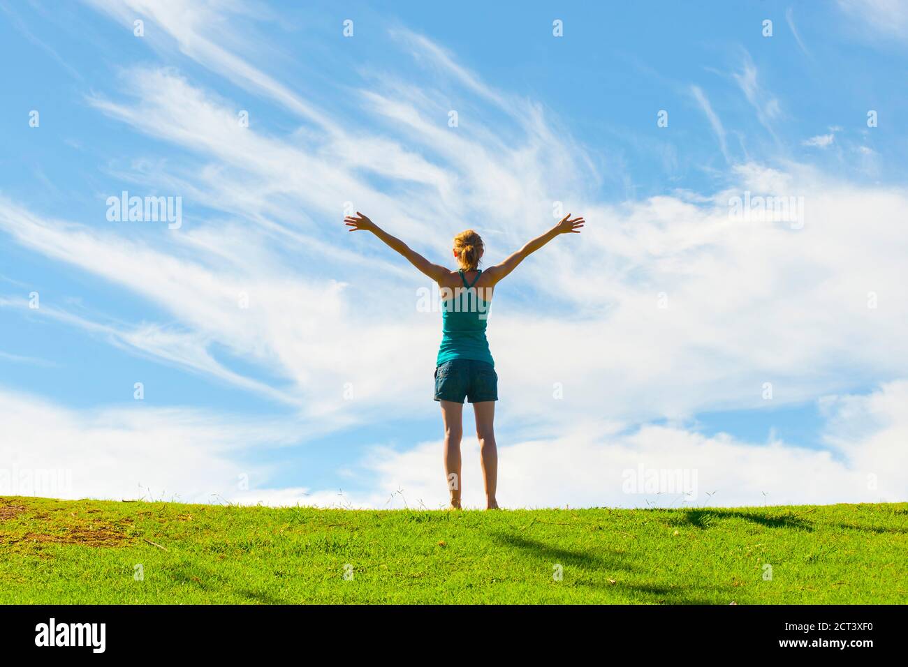 Happy woman raising arms up in air with joy, enjoying happiness of ...
