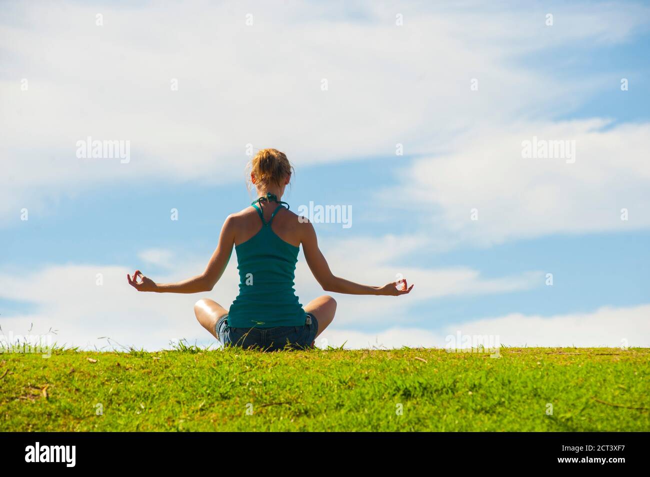 Peaceful woman meditating in a tranquil scene, enjoying spirituality in ...