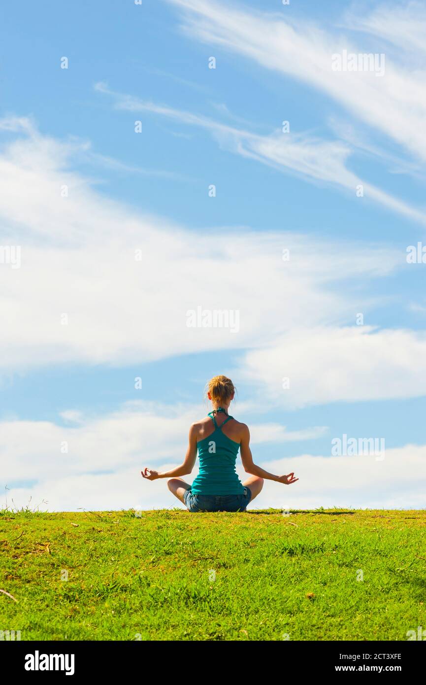 Peaceful woman meditating in a tranquil scene, enjoying spirituality in ...